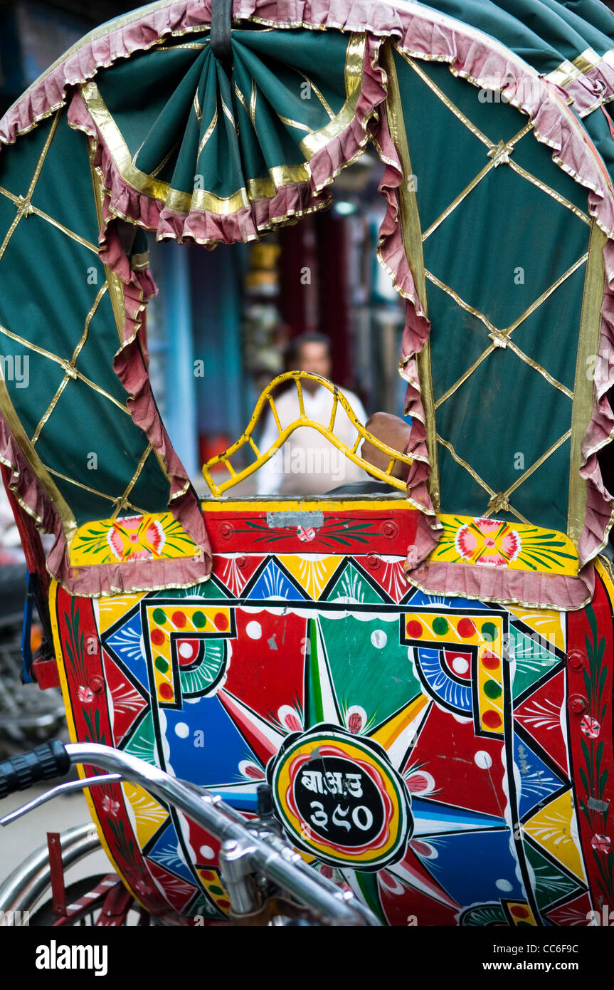 Colorful cycle rickshaws roaming the streets of Kathmandu Stock Photo ...