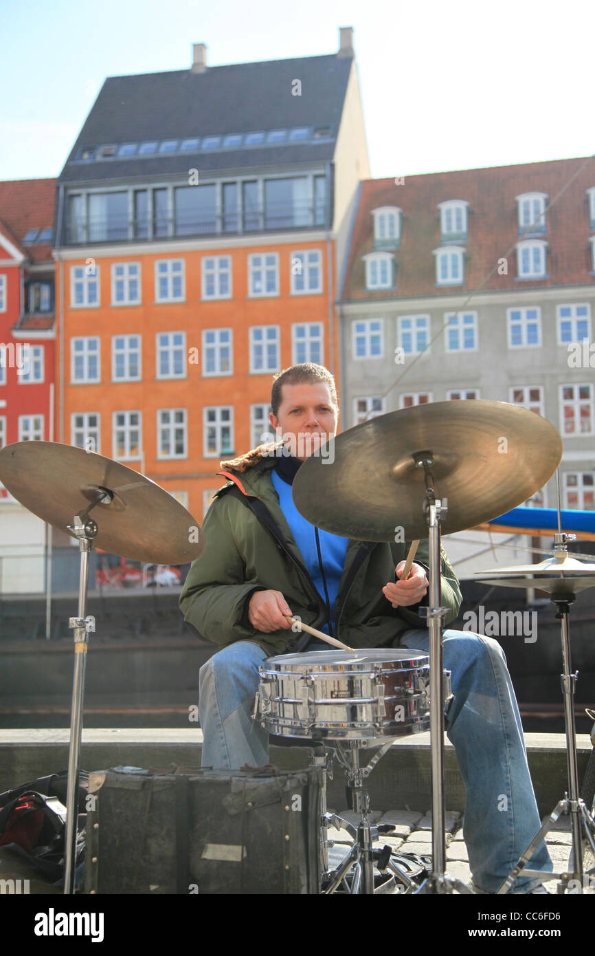 Caucasian drummer performing, Sluseholmen Canal District, Copenhagen ...