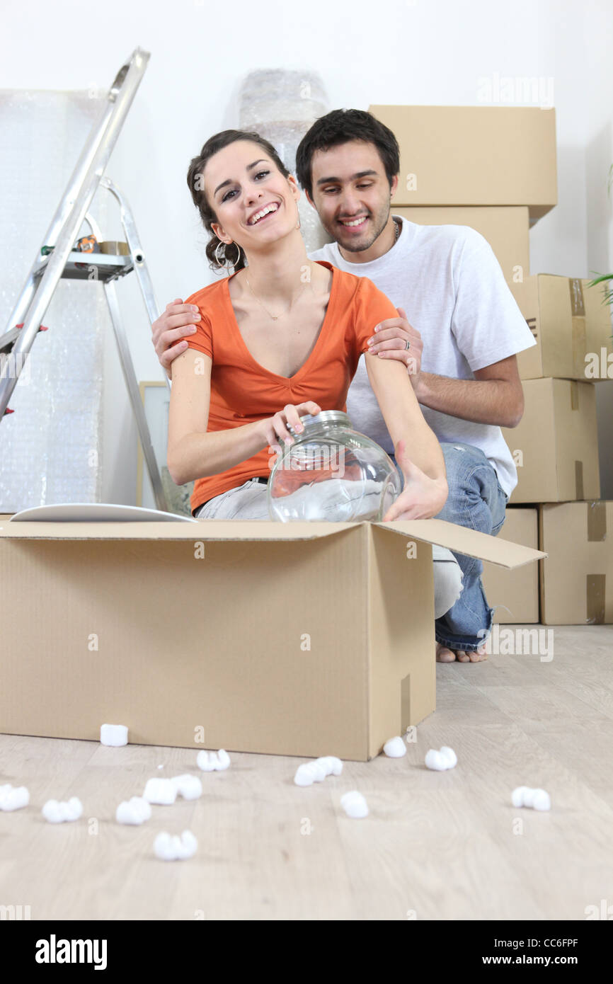 Couple removing glassware Stock Photo - Alamy
