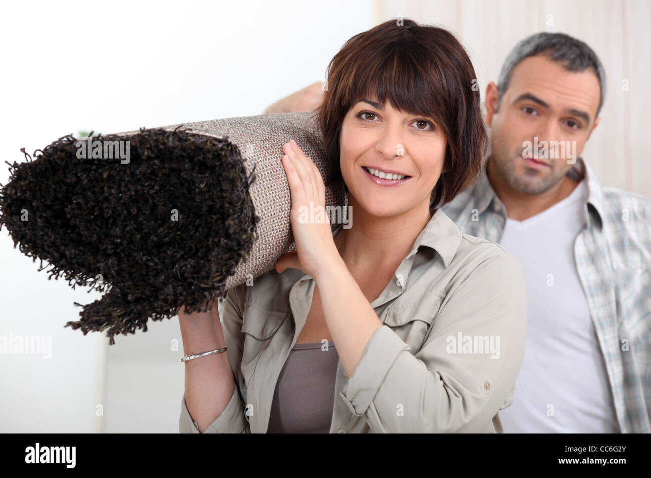 Man carrying roll of carpet hi-res stock photography and images - Alamy