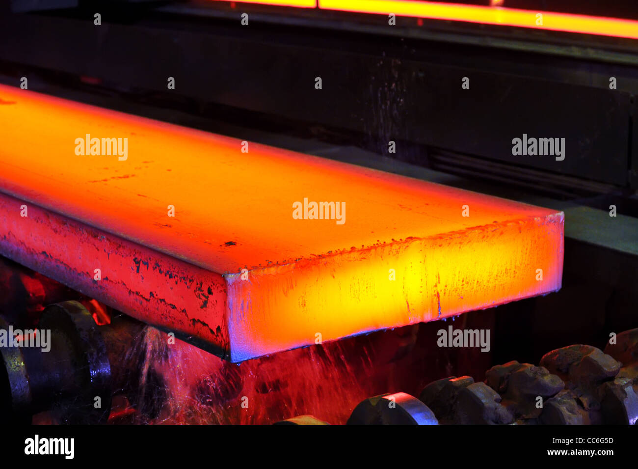 hot steel on conveyor Stock Photo - Alamy
