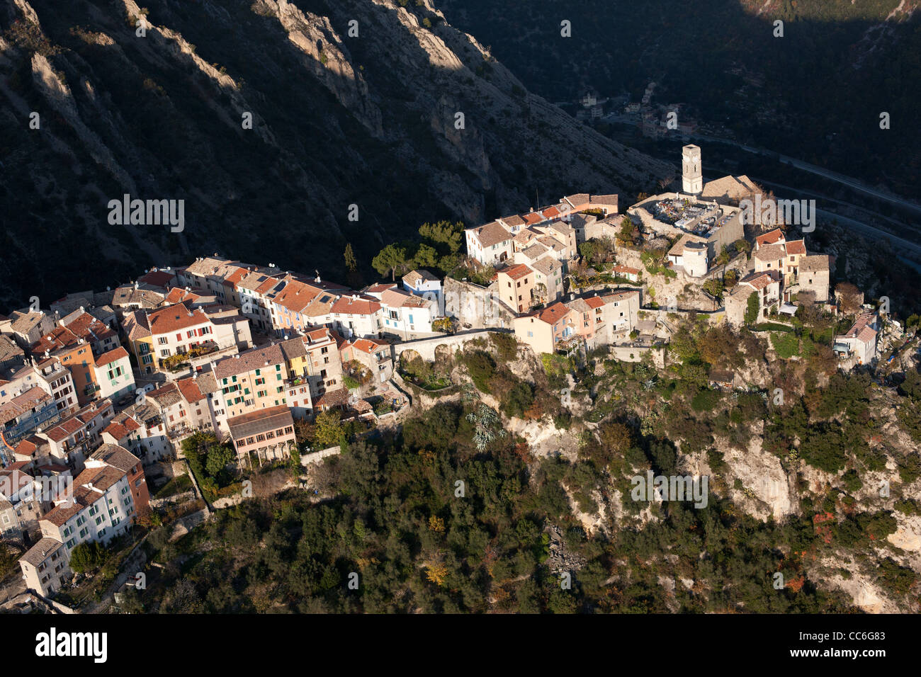 AERIAL VIEW. Perched medieval village on a rocky spur high above the ...