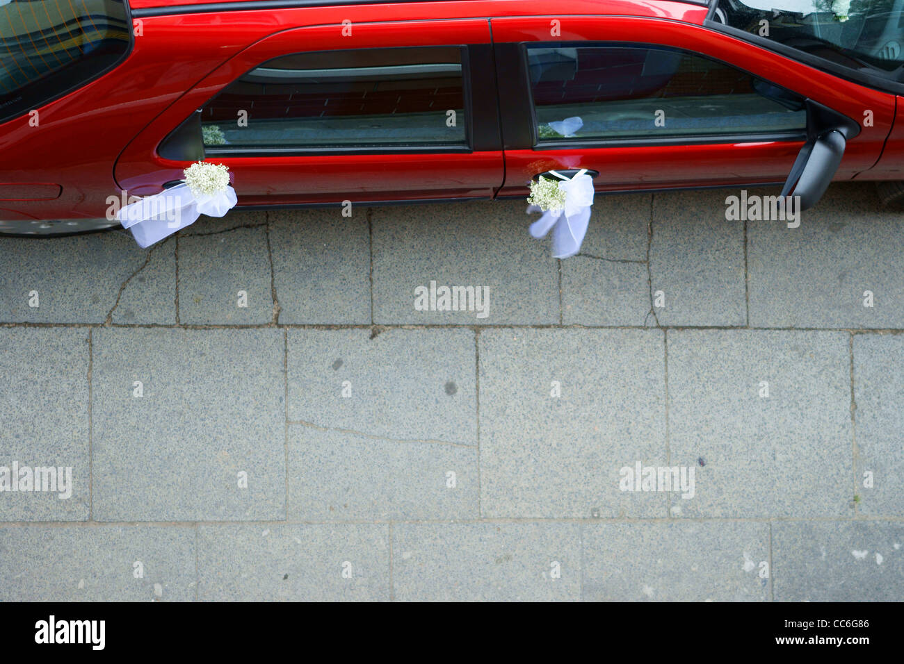 red car for ceremony. flowers and decorations at wedding Stock Photo ...