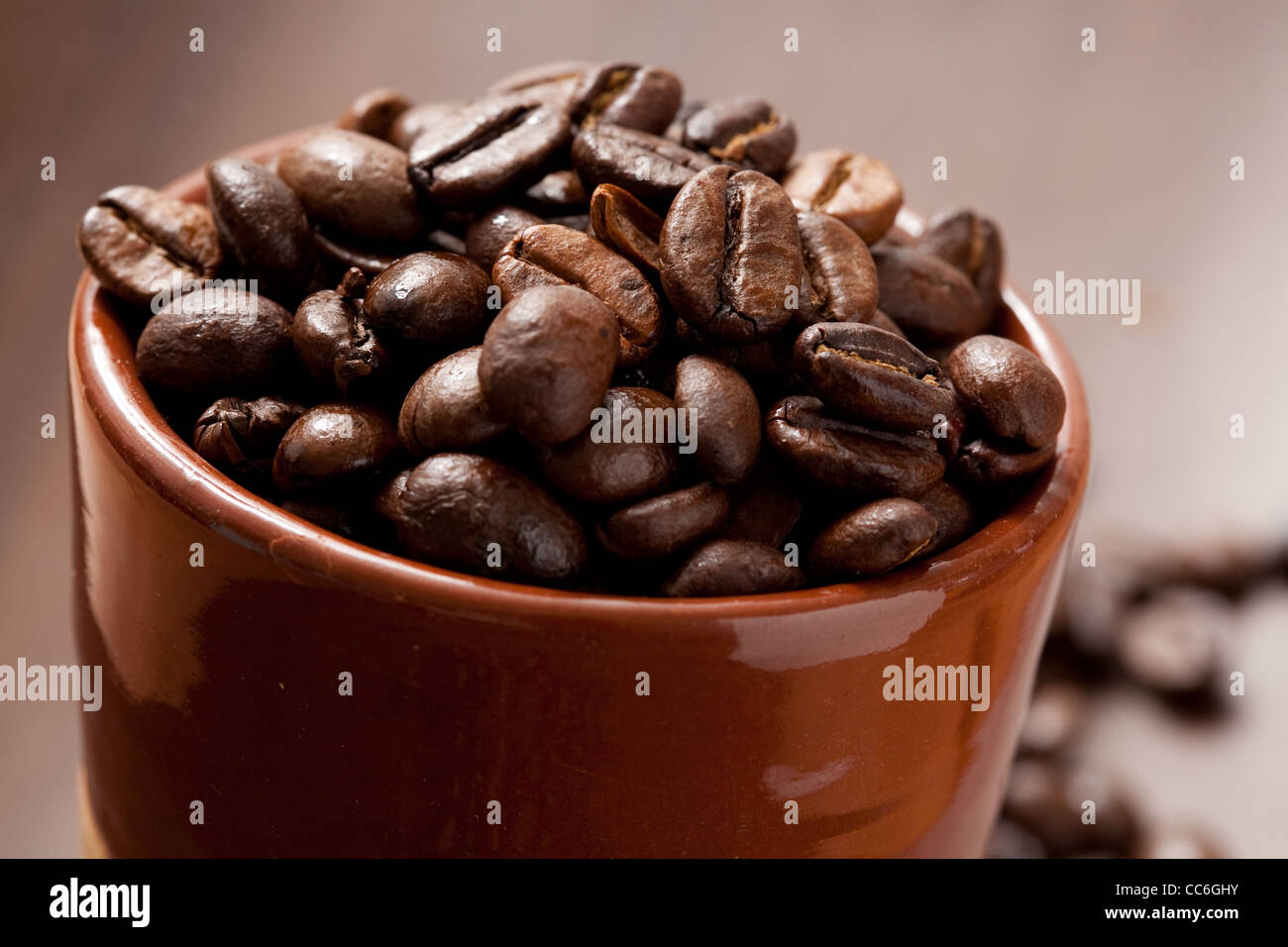 Close-up of coffee beans in a cup. Studio shot Stock Photo - Alamy