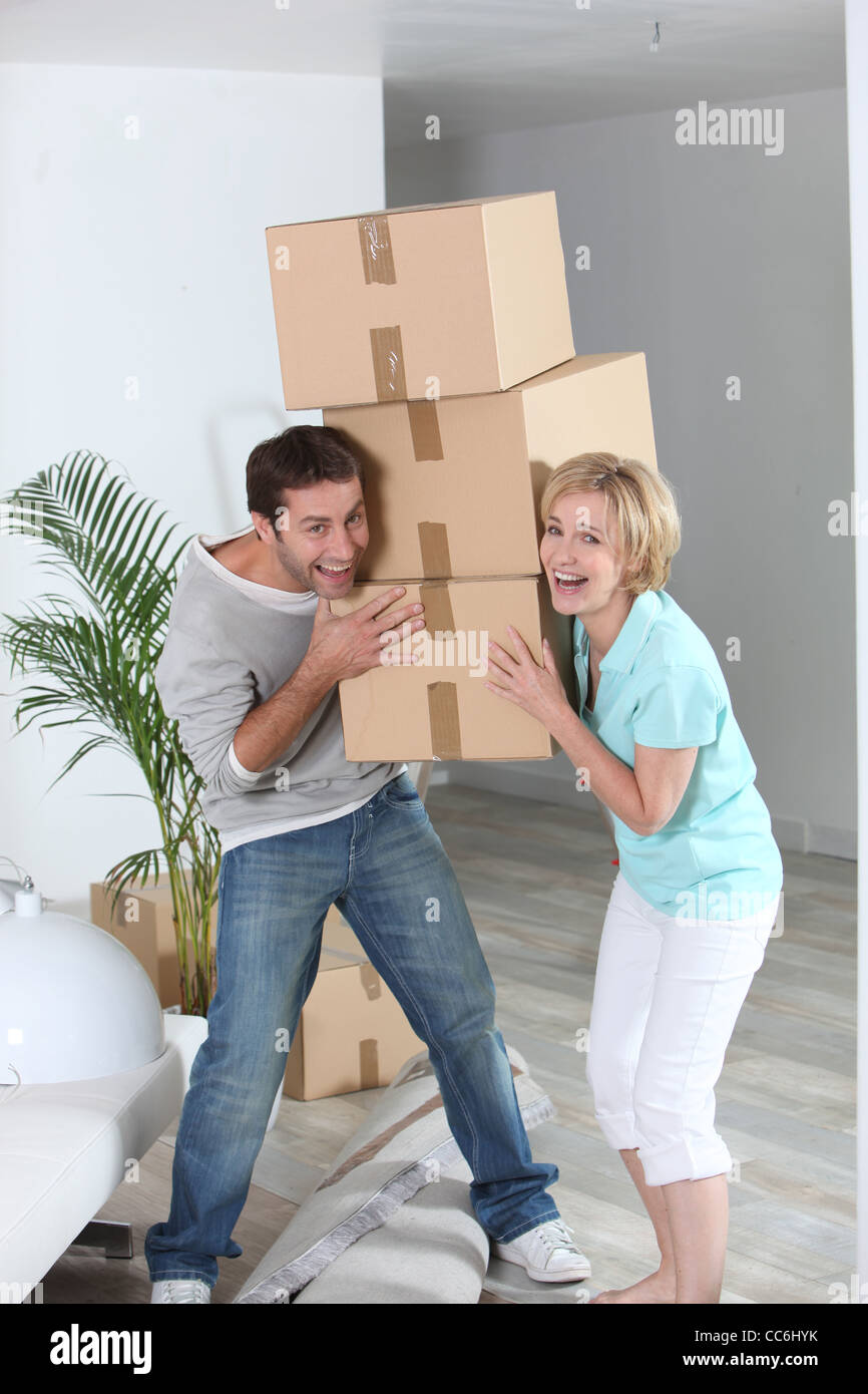 portrait of a couple with moving boxes Stock Photo - Alamy