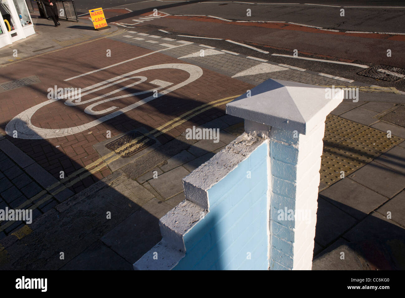 The various lines and markings with a 20mph speed zone warning, on an ...