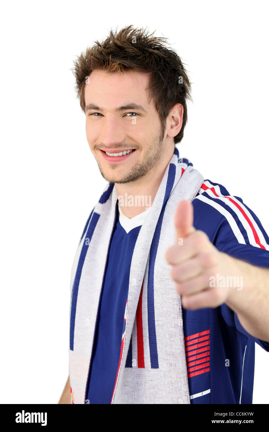 football fan making a thumbs up sign Stock Photo - Alamy