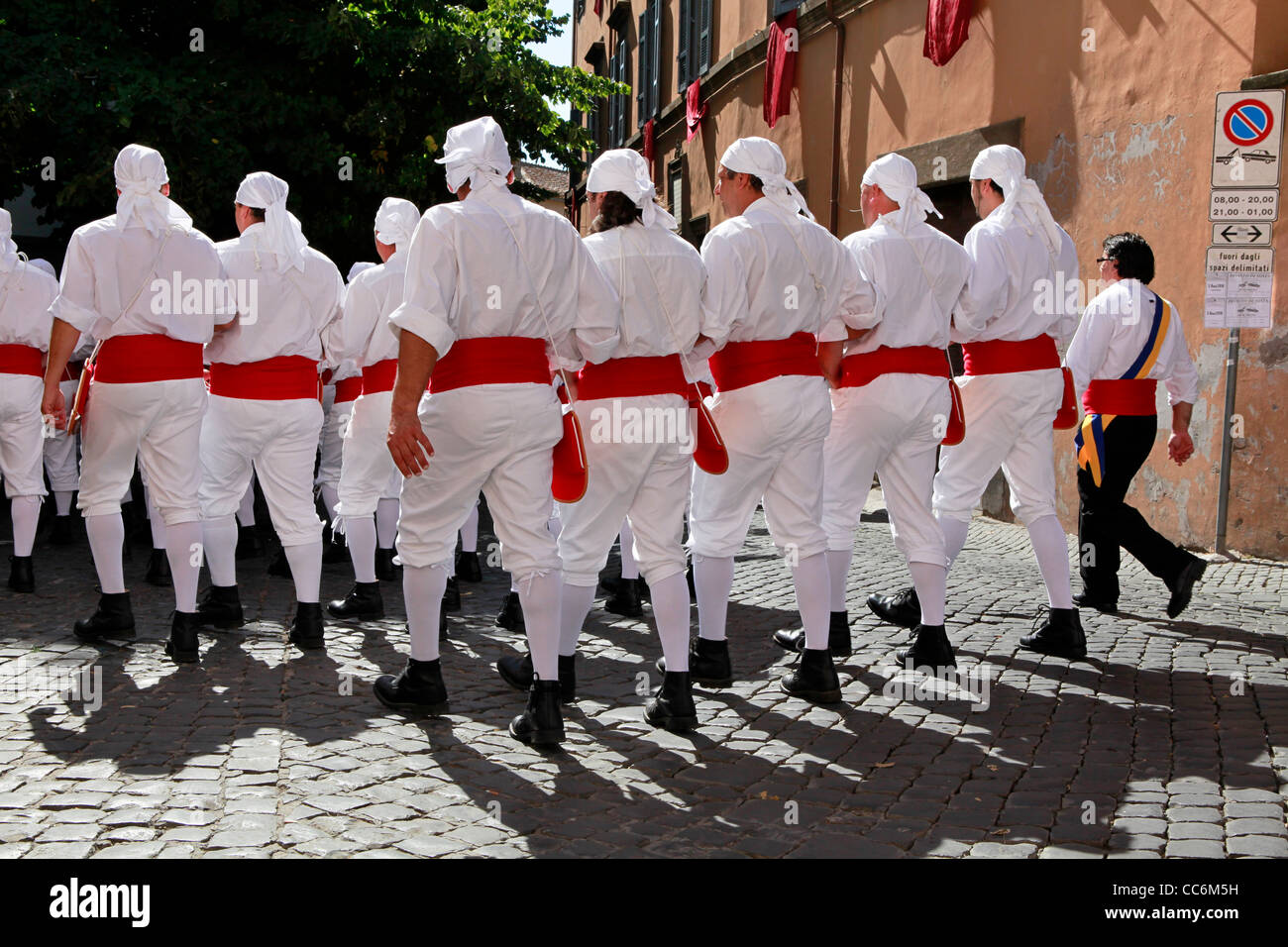 Facchini from Viterbo in Italy marching through the town's streets ...