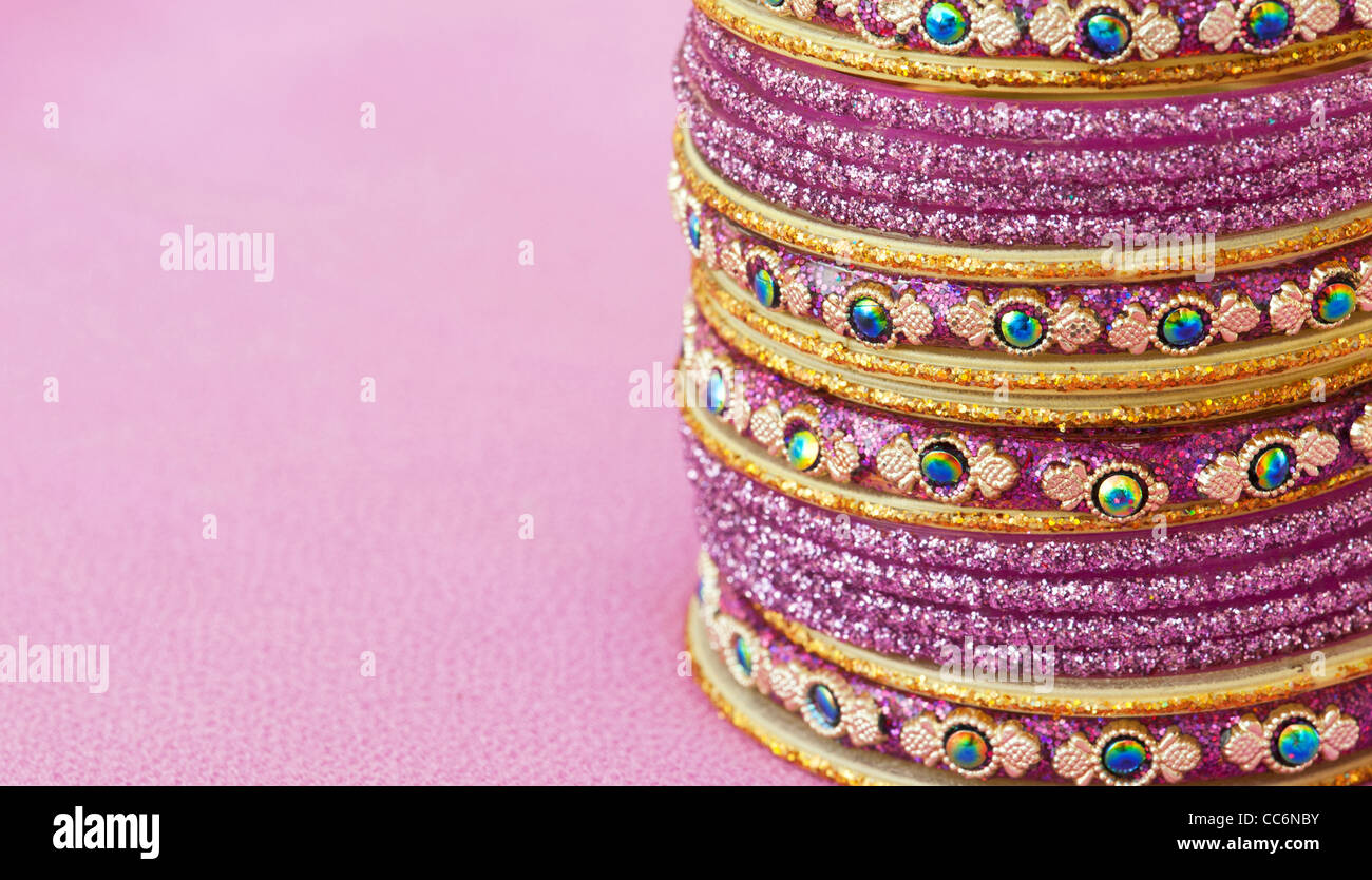 Pink Gold Indian glass coloured bangles Stock Photo - Alamy