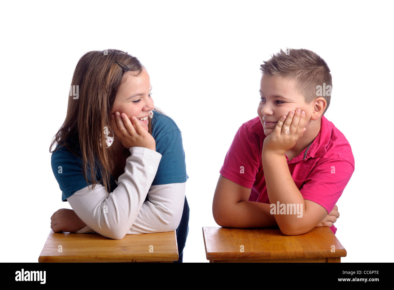 brother and sister looking at each other. Isolated on white background ...