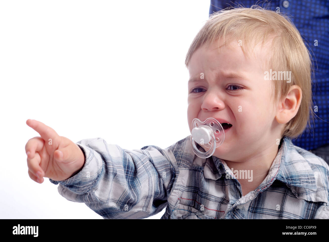 little crying child pointing with his finger Stock Photo - Alamy