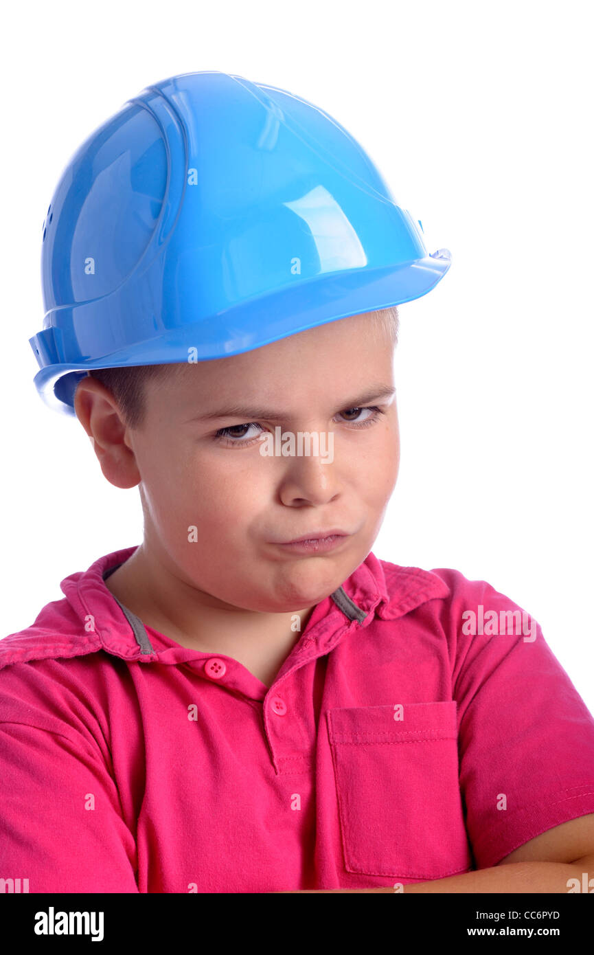 angry looking boy with pink shirt and blue protection helmet. isolated ...