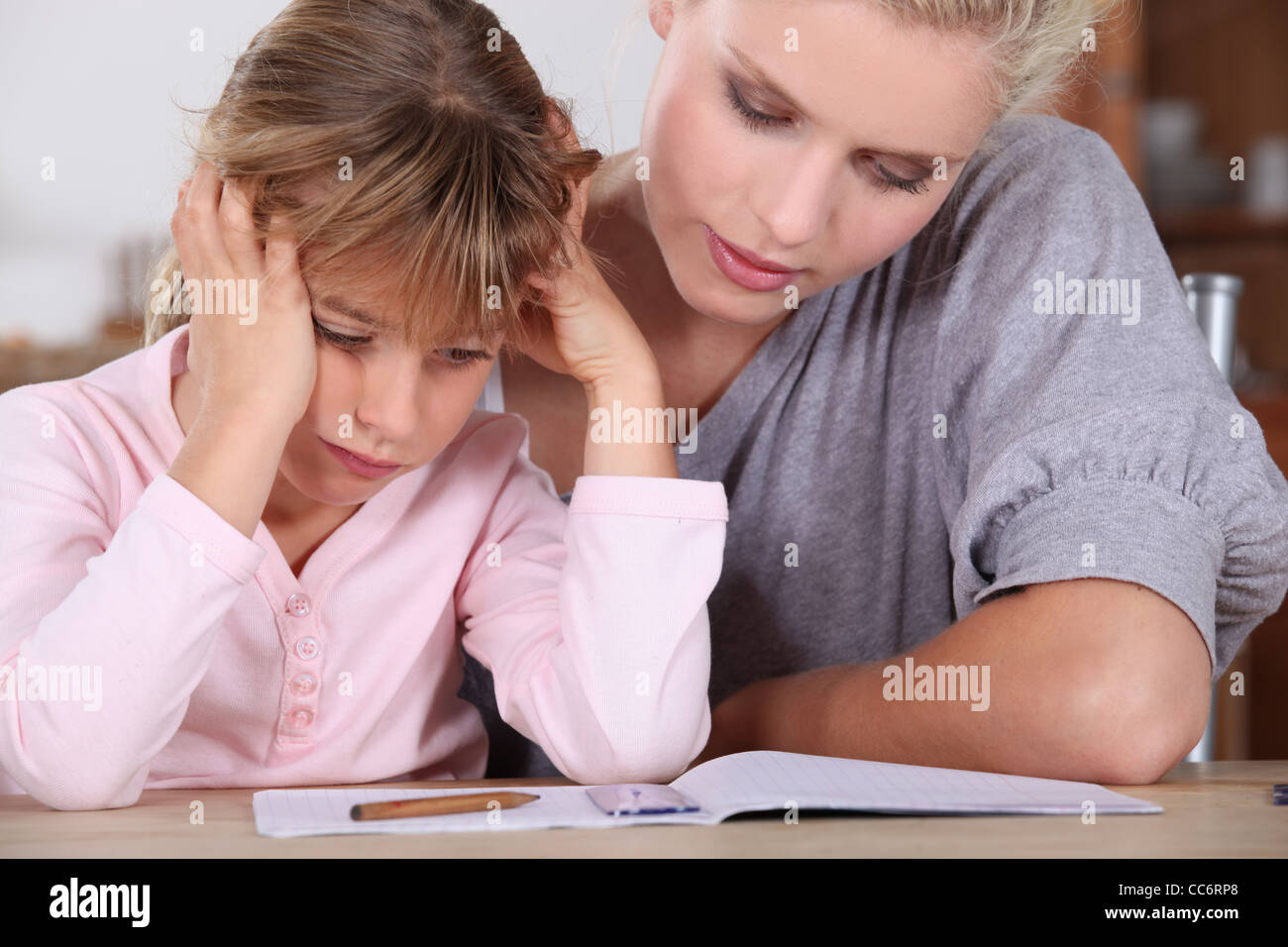 Mother and daughter doing homework Stock Photo - Alamy