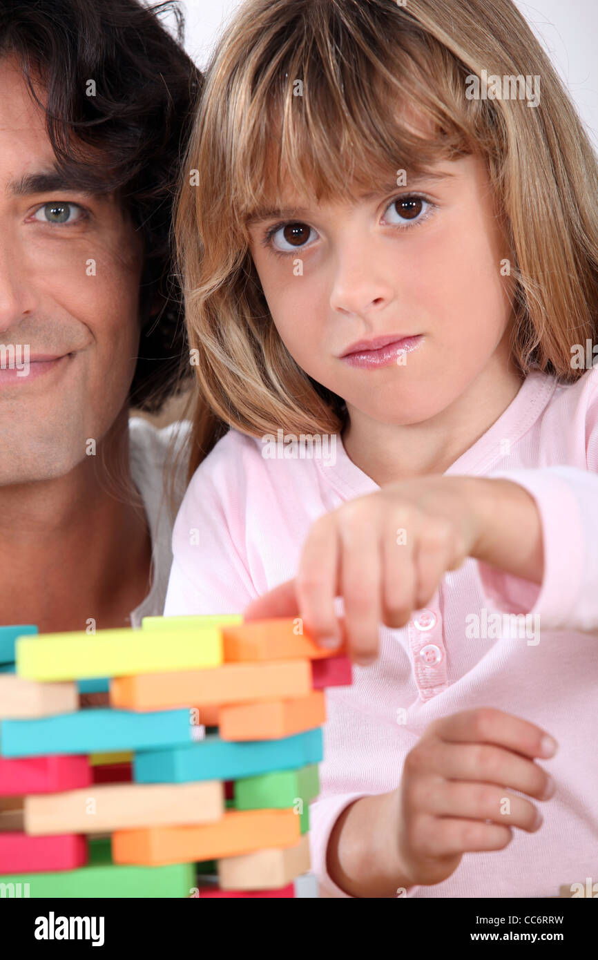 Father and daughter building a tower of blocks Stock Photo - Alamy
