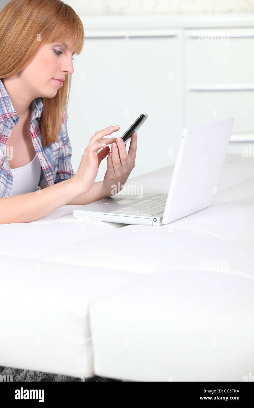Woman sending message with mobile telephone Stock Photo - Alamy