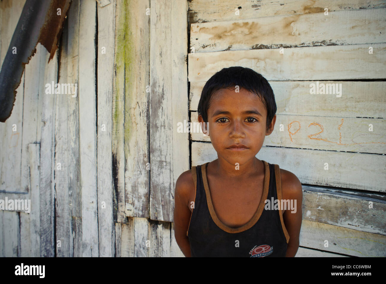 Poor boy outside of his home in the illegal settlement, barrio, of Los ...