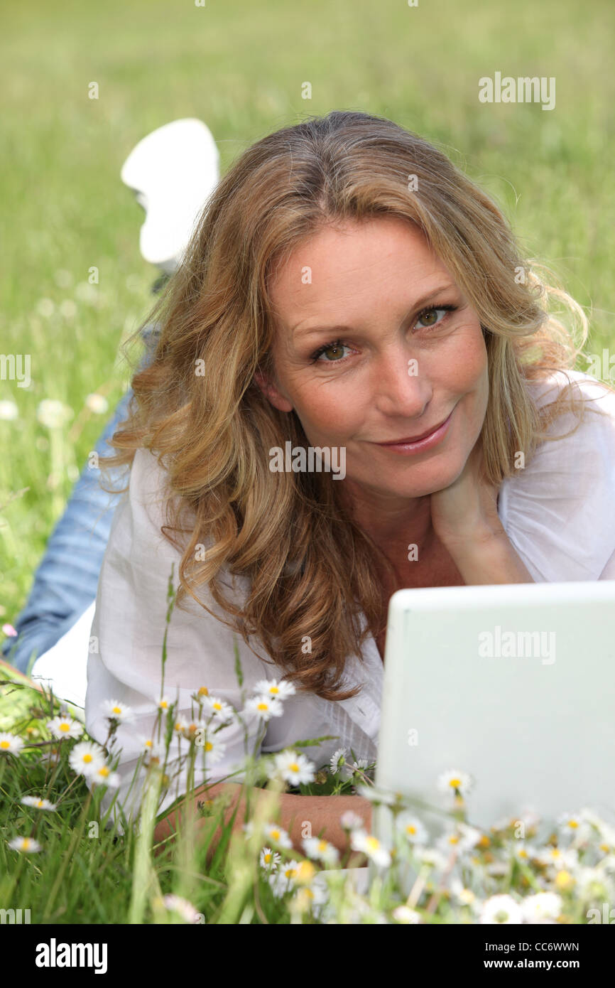 Woman on laptop Stock Photo - Alamy