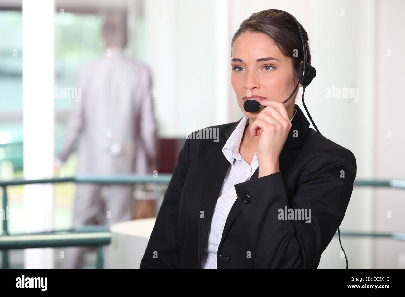 Woman wearing headset Stock Photo - Alamy