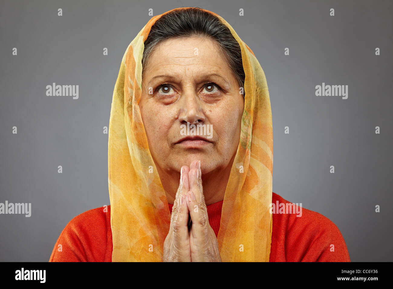 Portrait single woman praying hi-res stock photography and images - Alamy