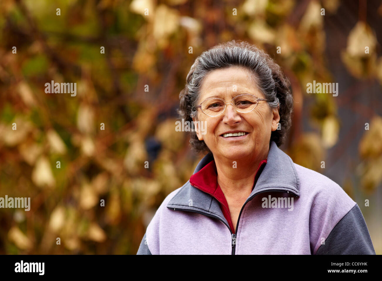 Closeup portrait of a cheerful grandma outdoor in the nature Stock ...