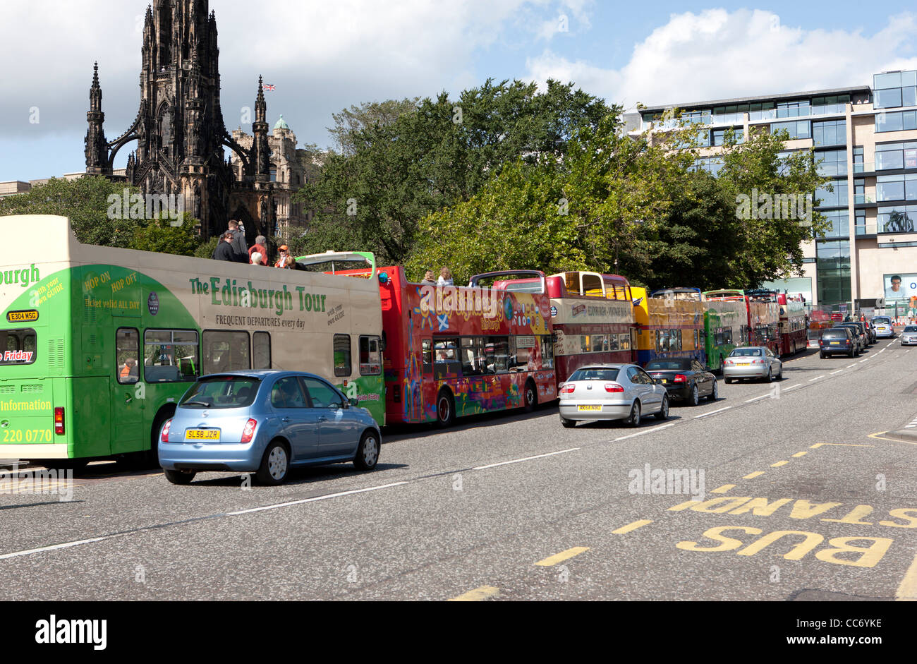 Edinburgh tour buses outside Waverley station with the Scott monument ...