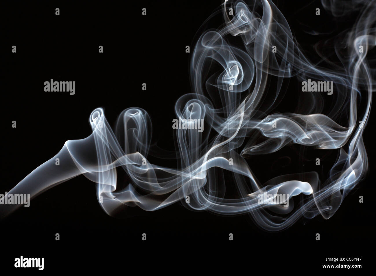 Abstract smoke curling and creating beautiful shapes Stock Photo - Alamy