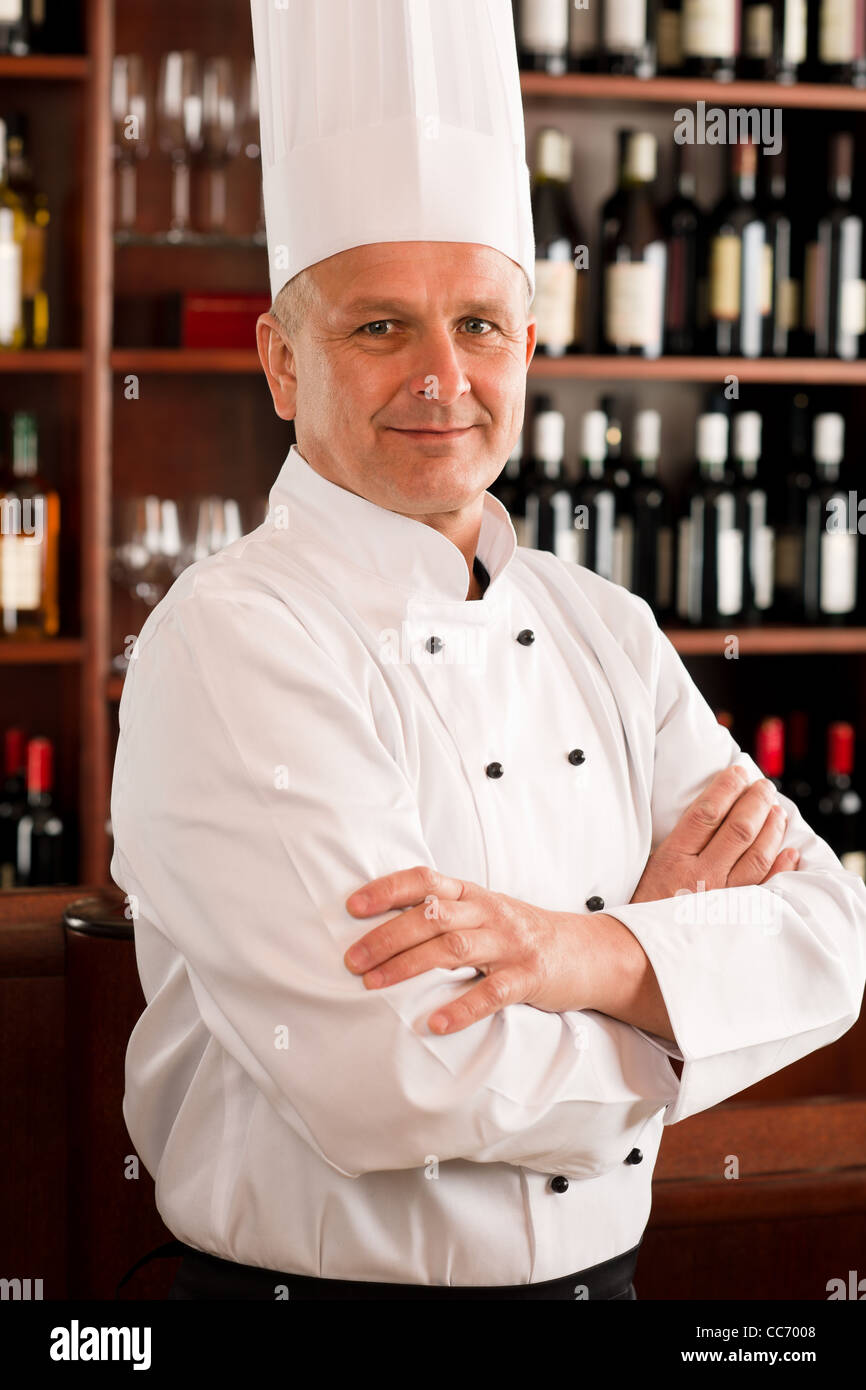 Chef cook confident professional posing in restaurant cross arms Stock ...