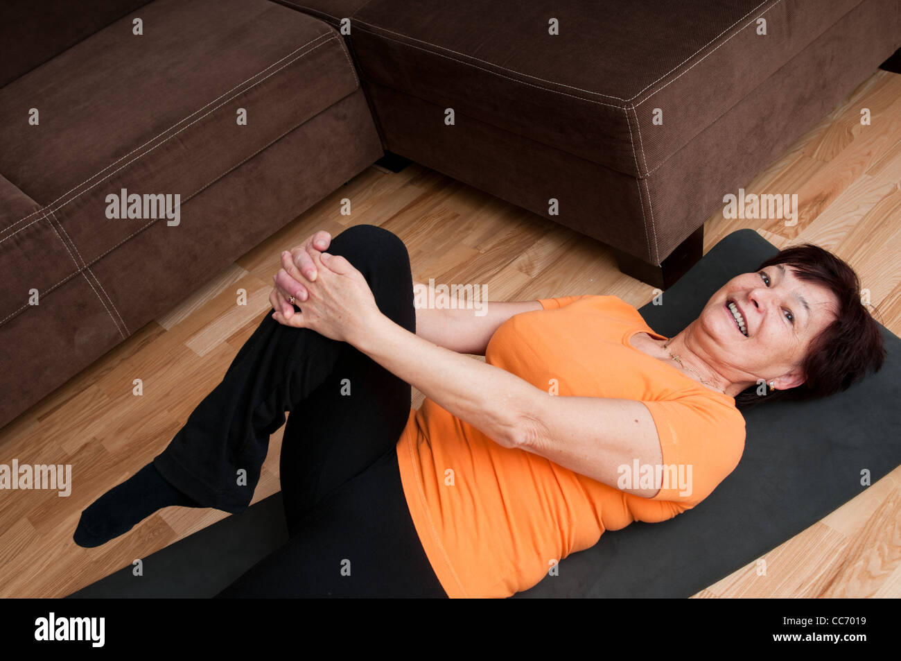 Senior woman exercising at home Stock Photo - Alamy