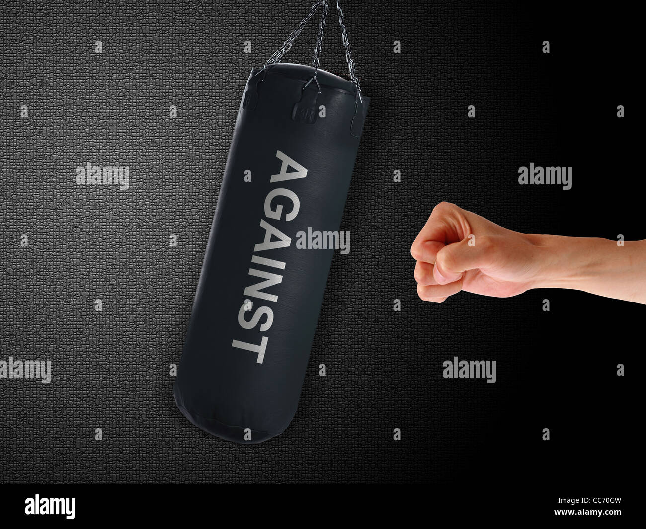 boxing punch bag and hand punching it on black background Stock Photo ...