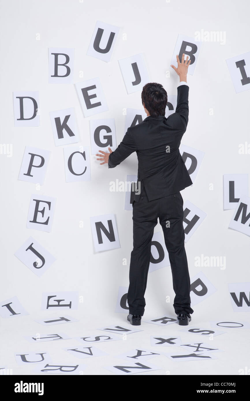 Man standing letter alphabet hi-res stock photography and images - Alamy