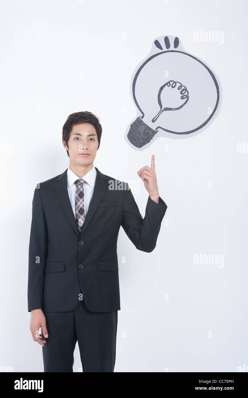 A man pointing the bulb Stock Photo - Alamy