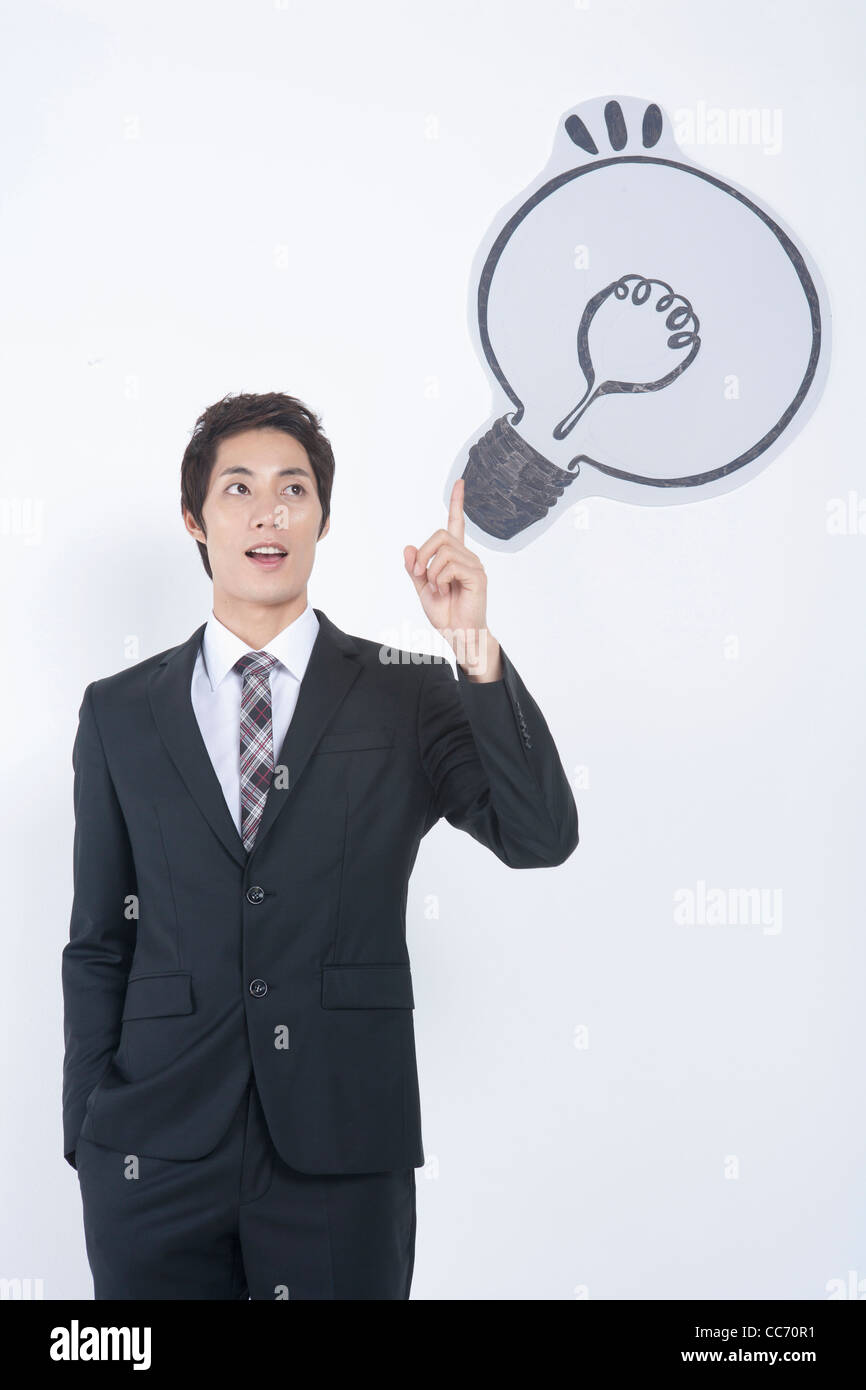 A man pointing the bulb Stock Photo - Alamy