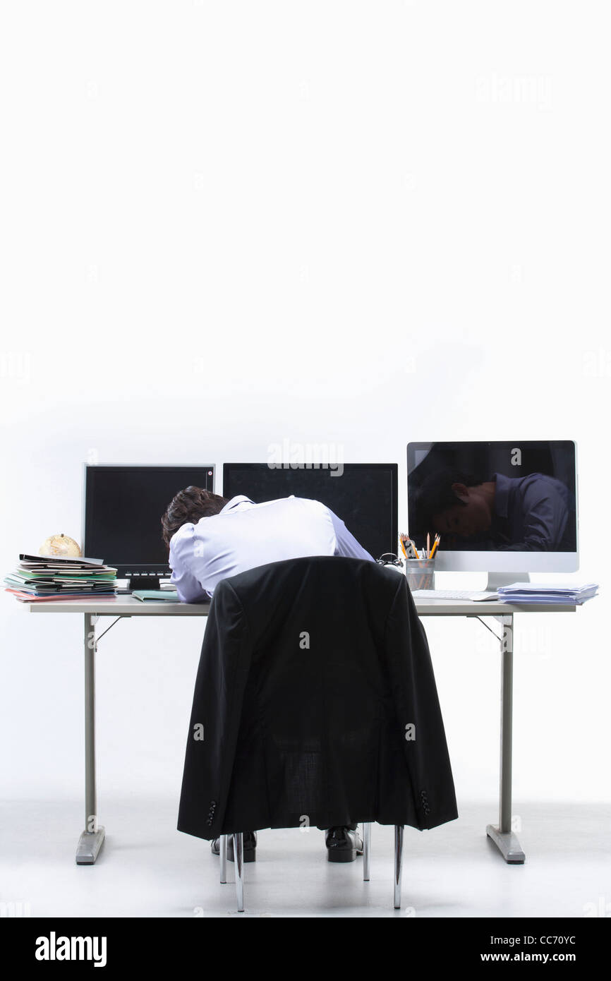 A stressful man in front of monitors Stock Photo - Alamy