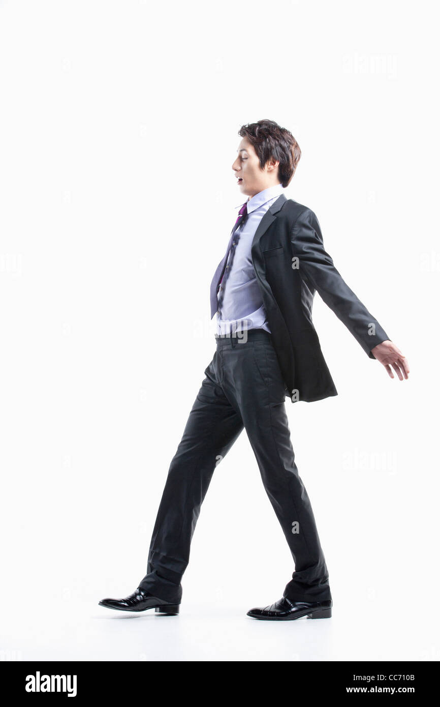 A man hard to walk forward hit by the wind Stock Photo - Alamy