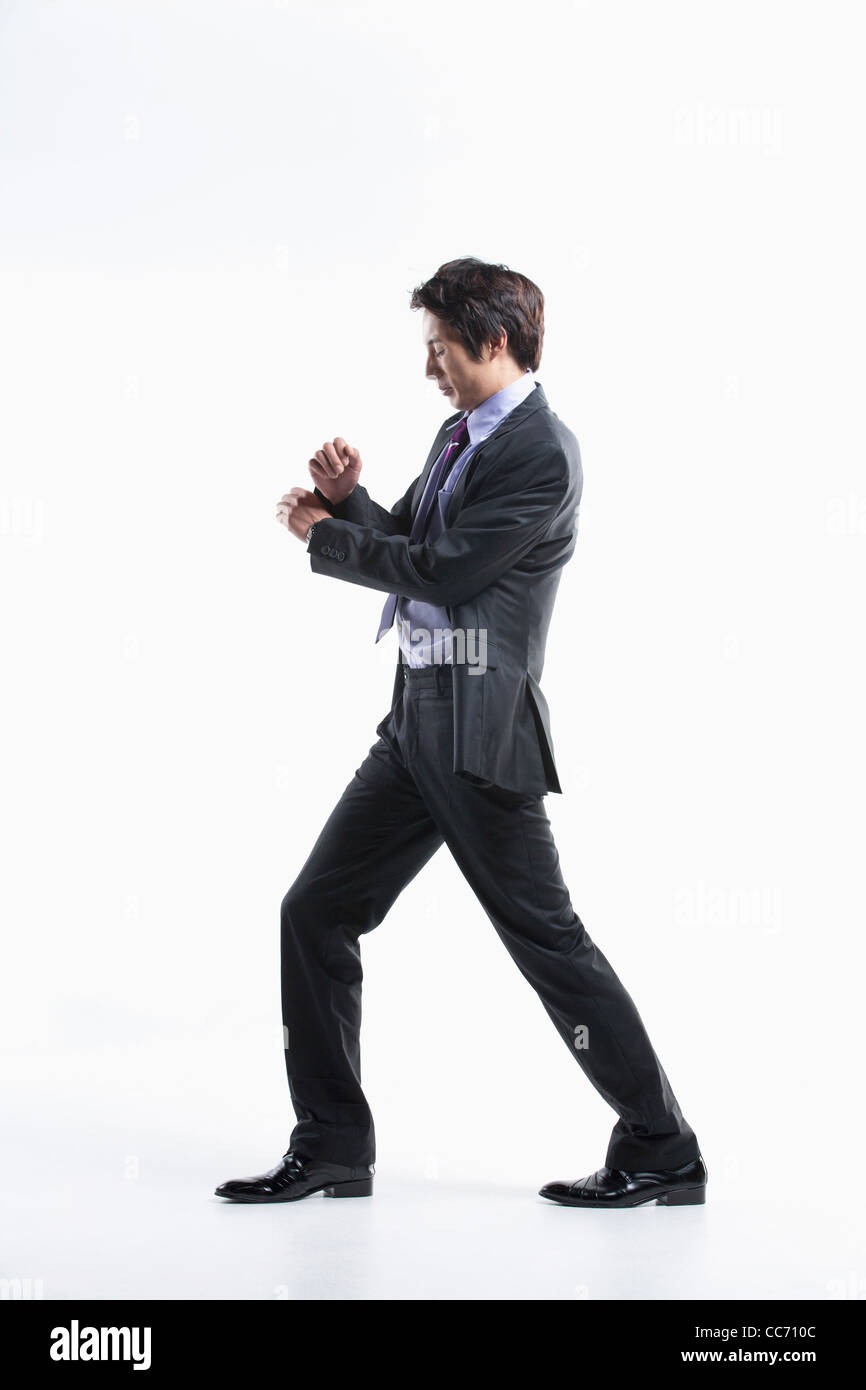 A man hard to walk forward hit by the wind Stock Photo - Alamy