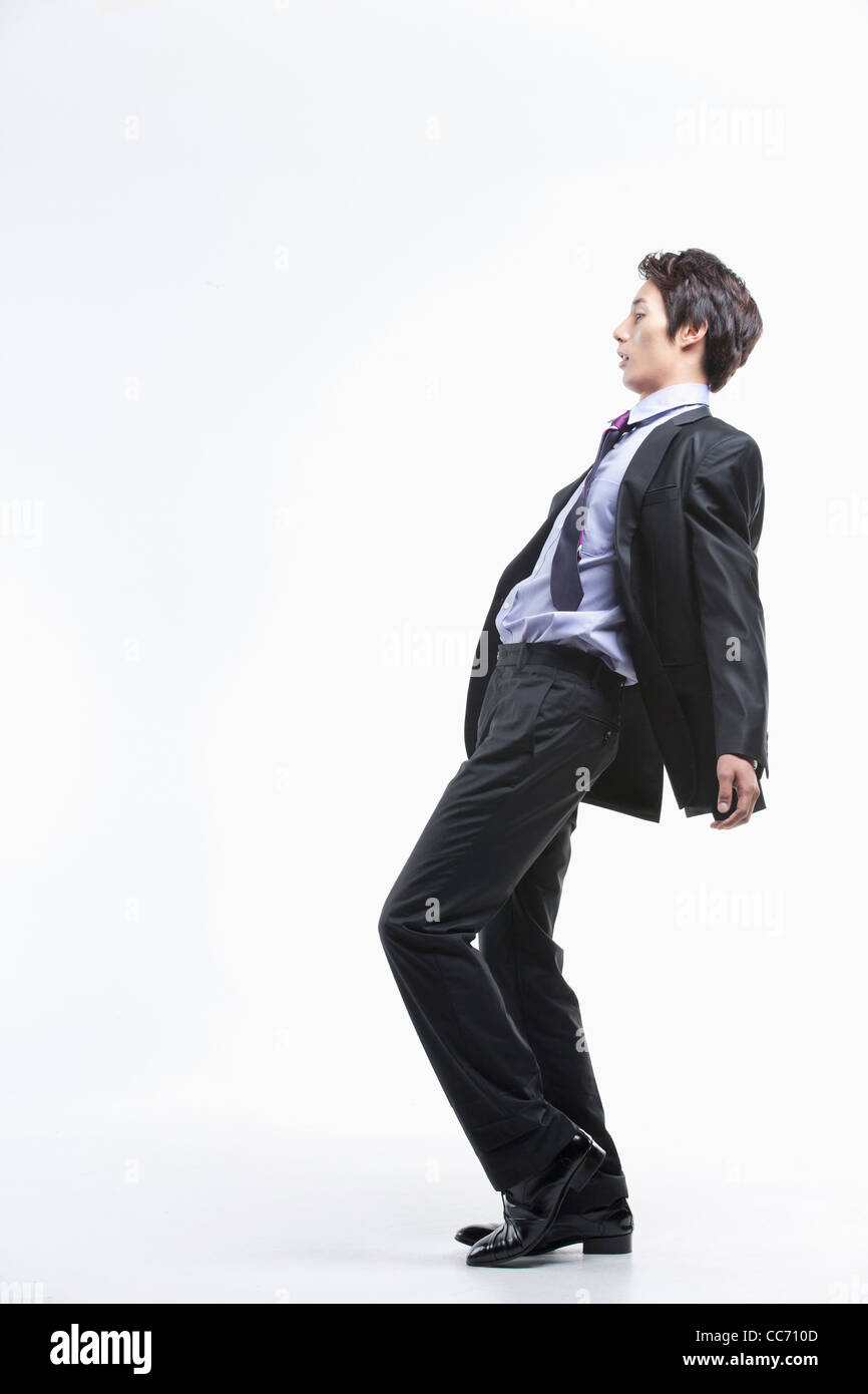 A man hard to walk forward hit by the wind Stock Photo - Alamy