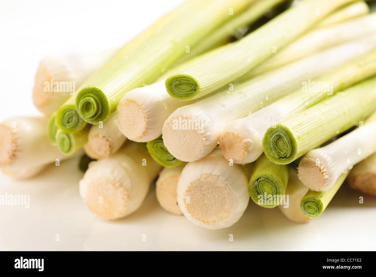 Closeup of freshly cut leek isolated on white background Stock Photo ...