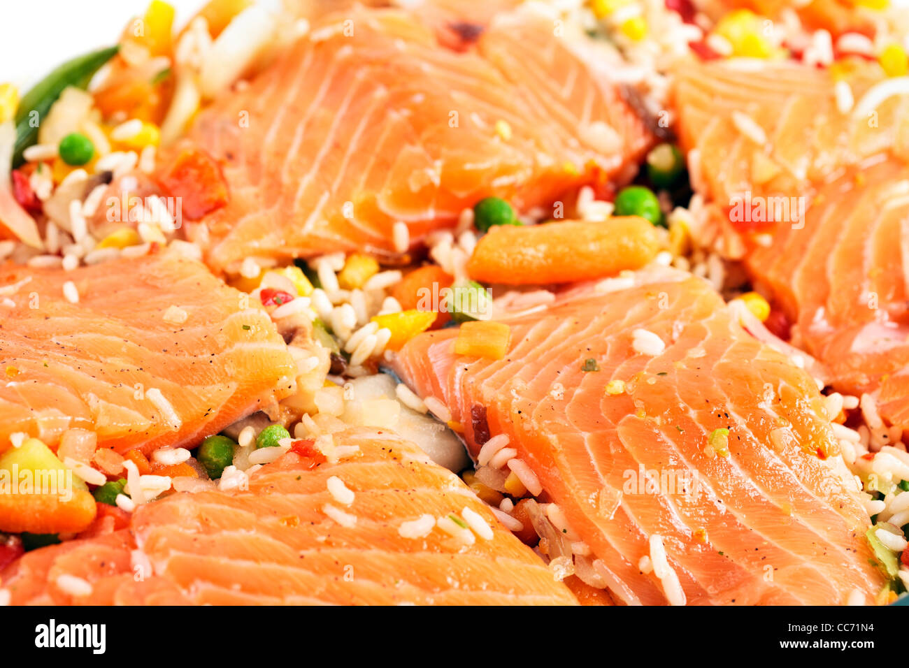 Red salmon fillets garnished with frozen vegetables and herbs Stock ...
