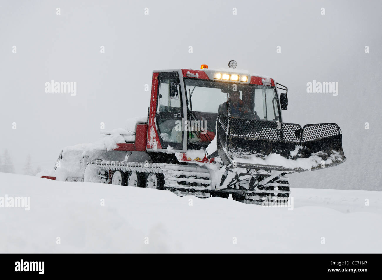 A piste basher making a ski track Stock Photo - Alamy