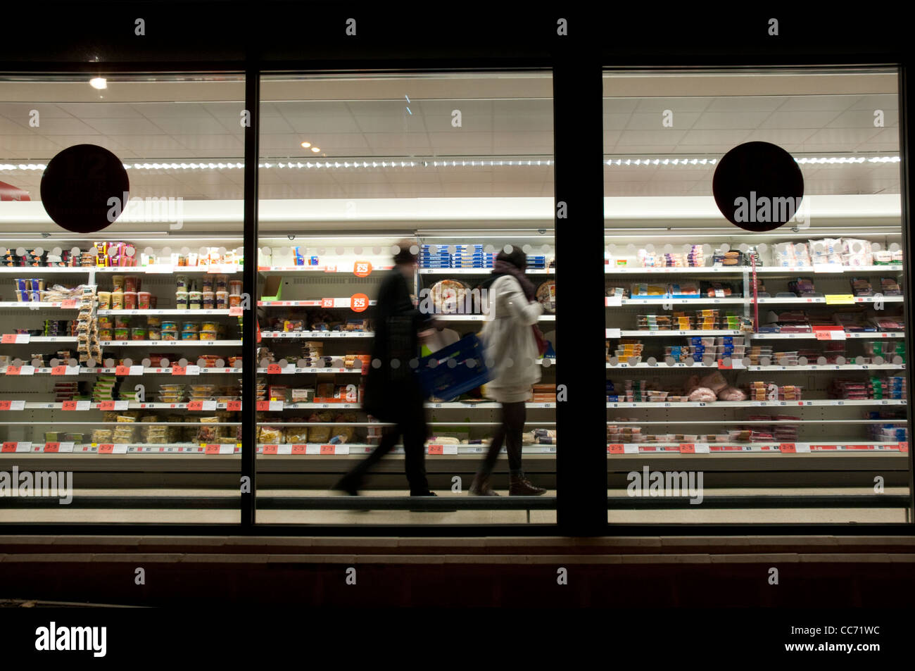 Supermarket at night photographed from outside Stock Photo - Alamy