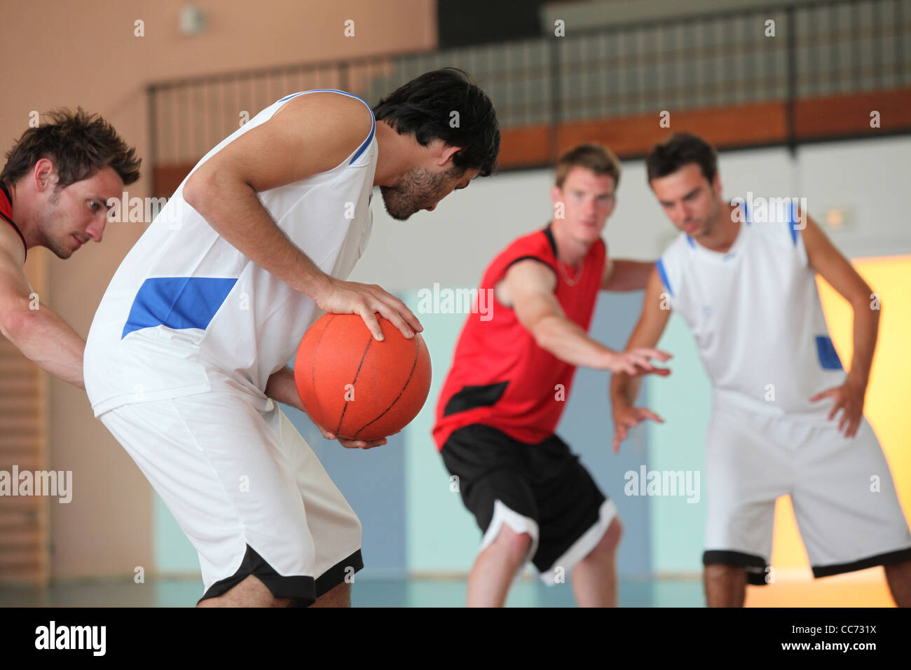 Basketball player dribbling Stock Photo - Alamy