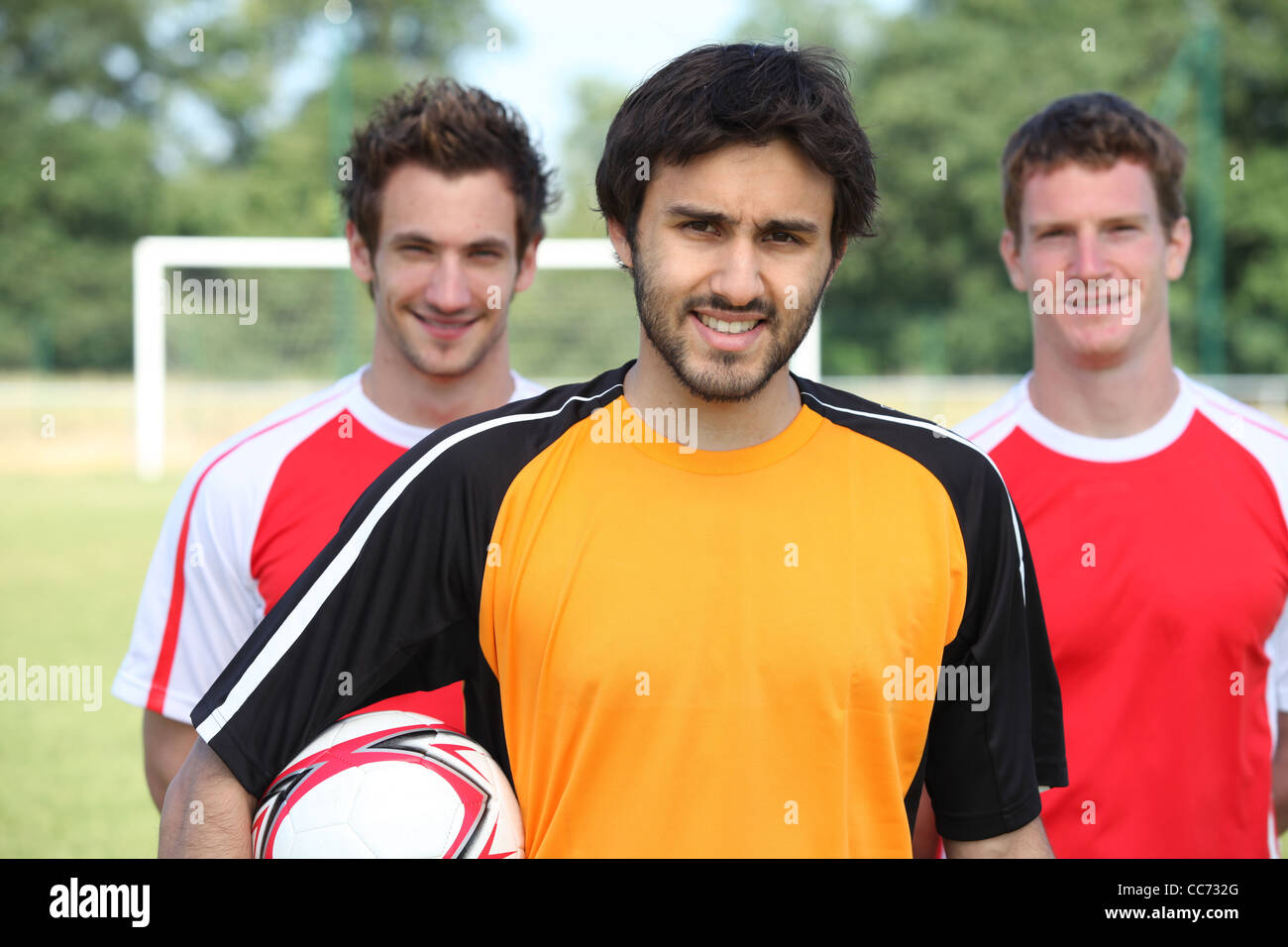 Football players wearing red hi-res stock photography and images - Alamy