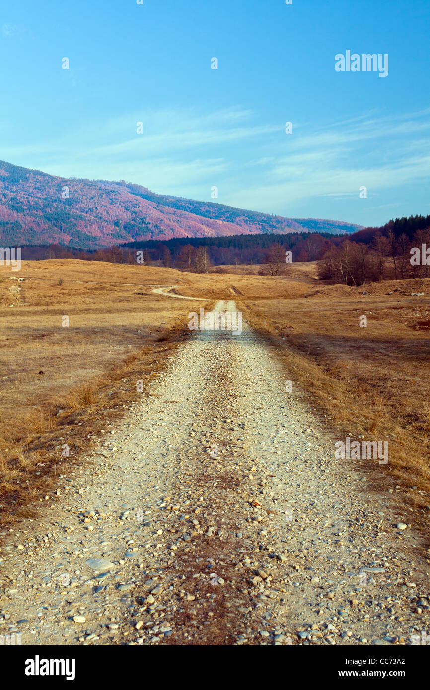 Landscape with dirt road in rural area Stock Photo - Alamy