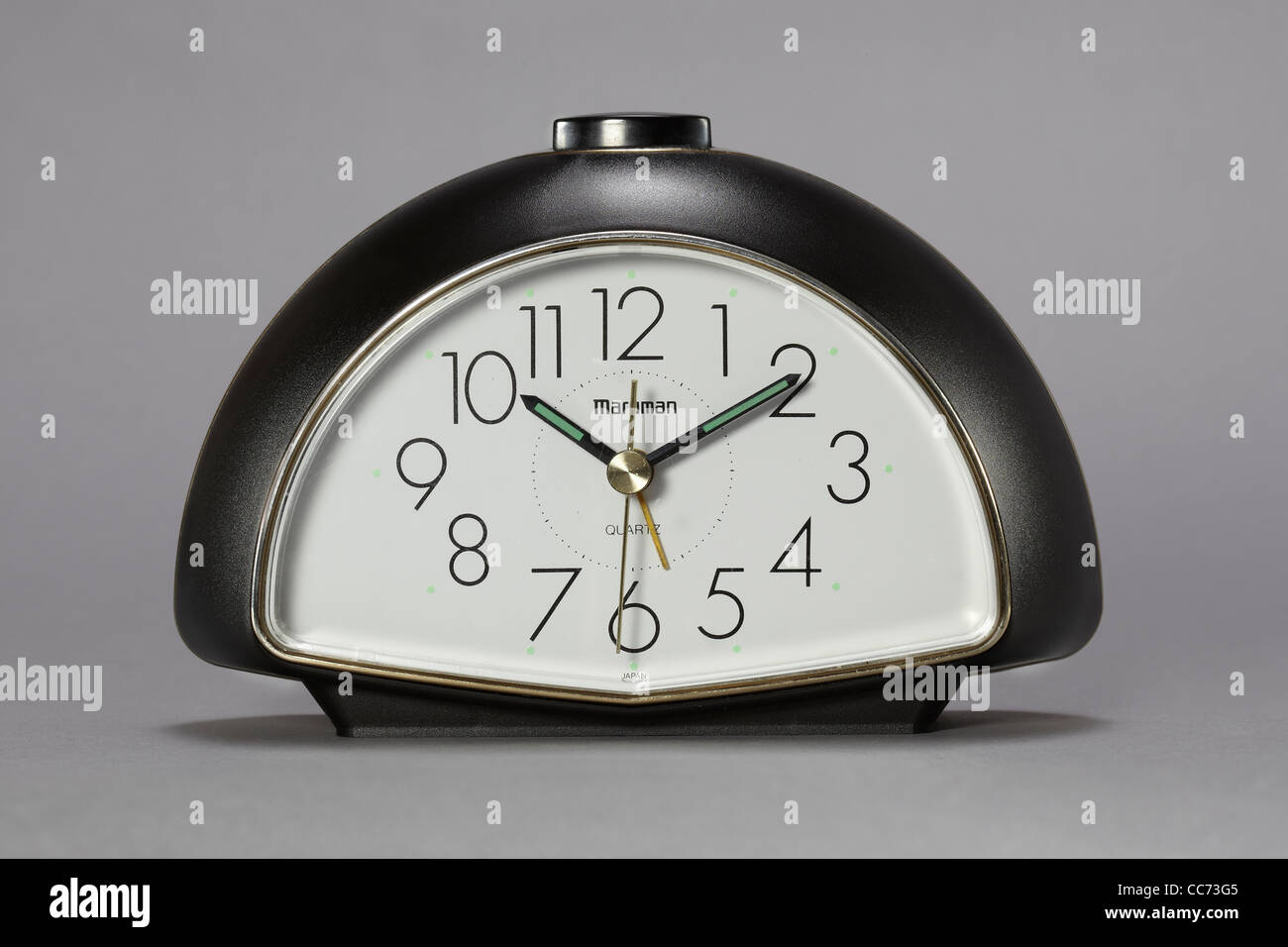 Alarm Clock on plain backdrop Stock Photo - Alamy