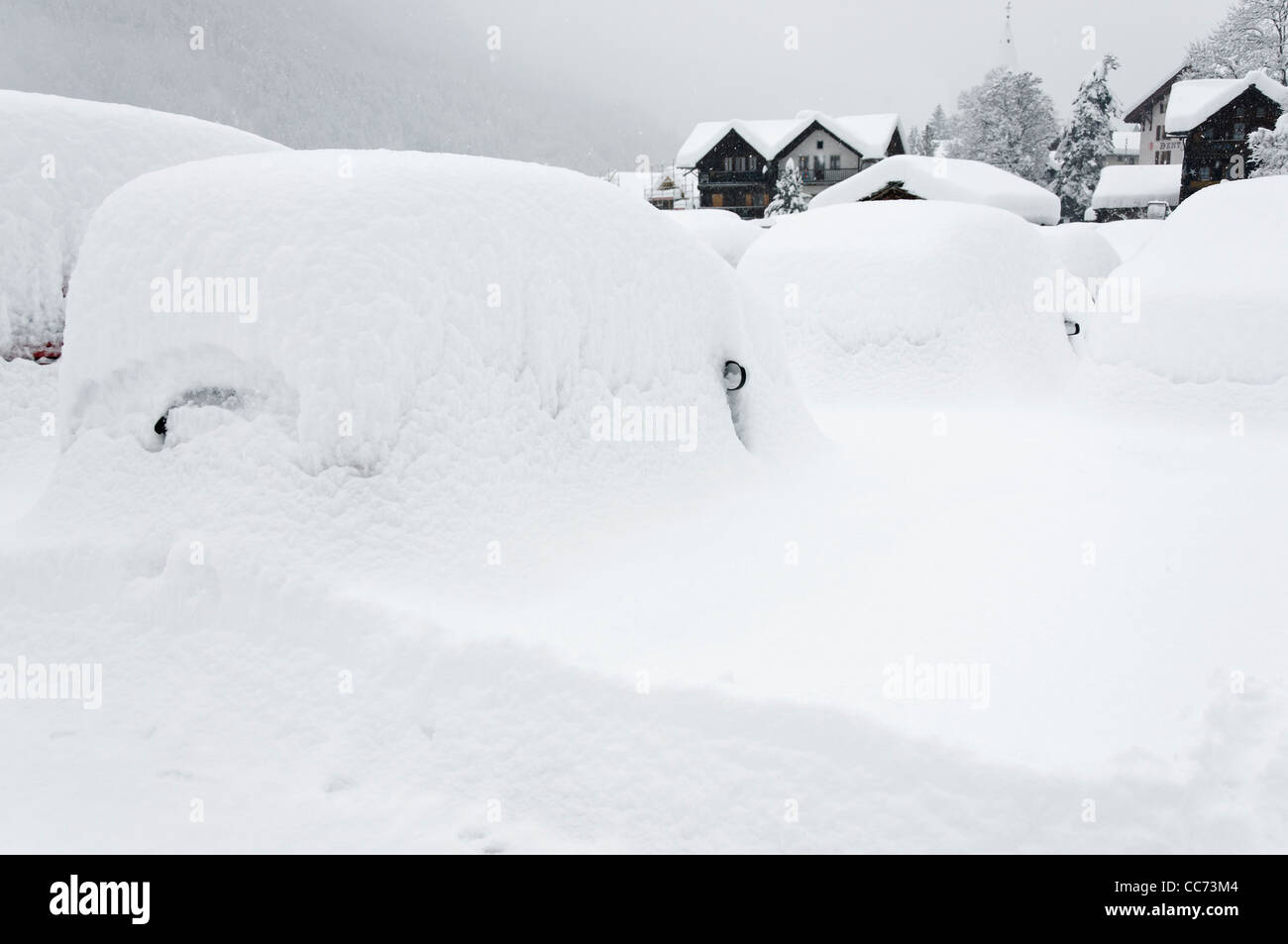 Cars in a car park covered in very deep snow Stock Photo - Alamy
