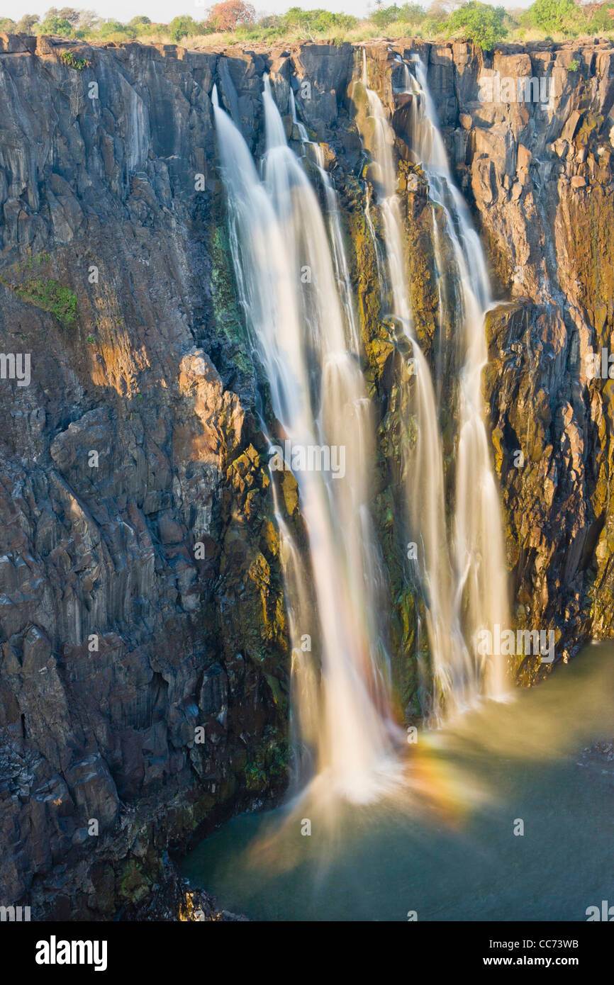 Sunrise Rainbow in Victoria Falls at the Eastern Cataract. Water level ...