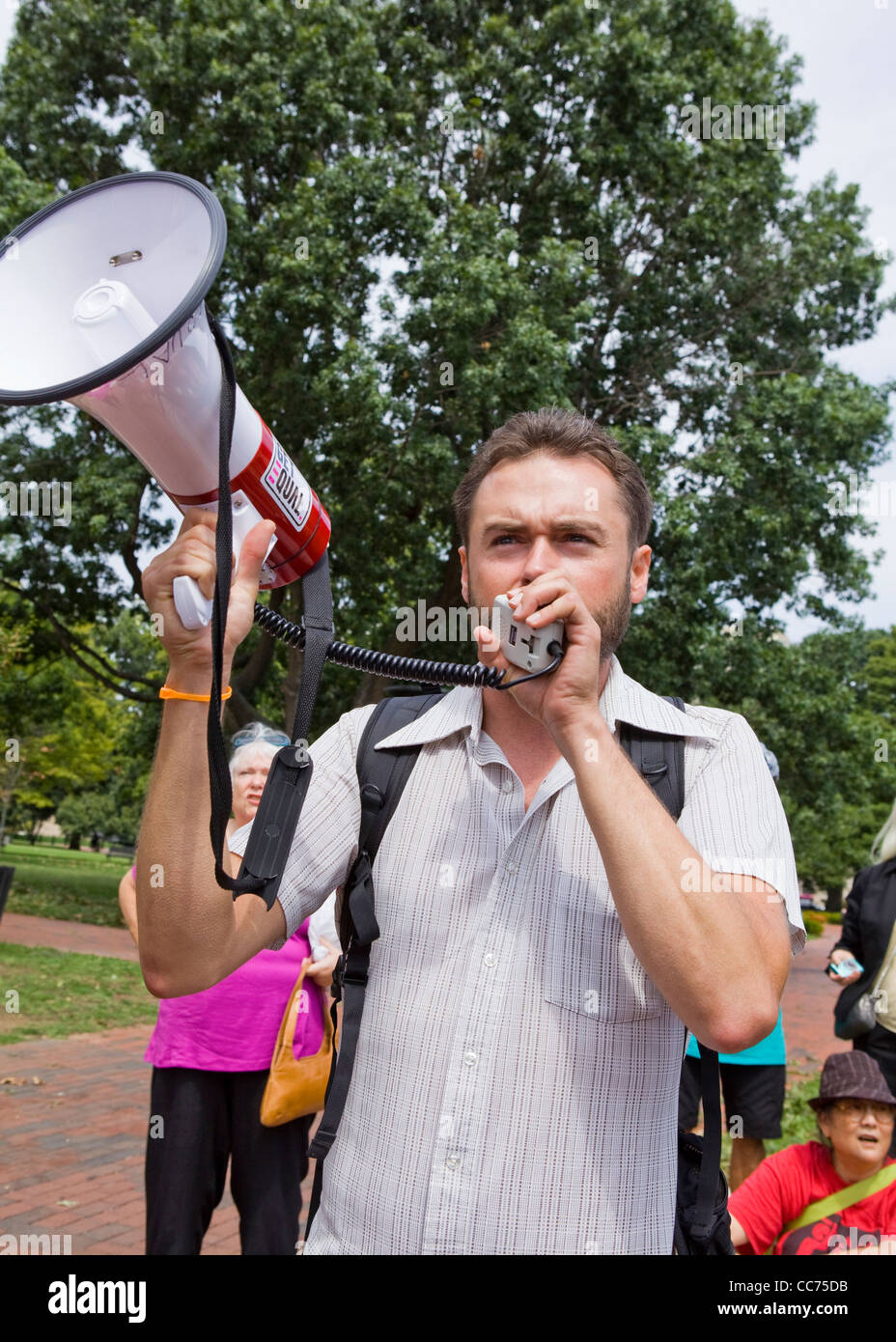 Protester speaking through a bullhorn Stock Photo - Alamy