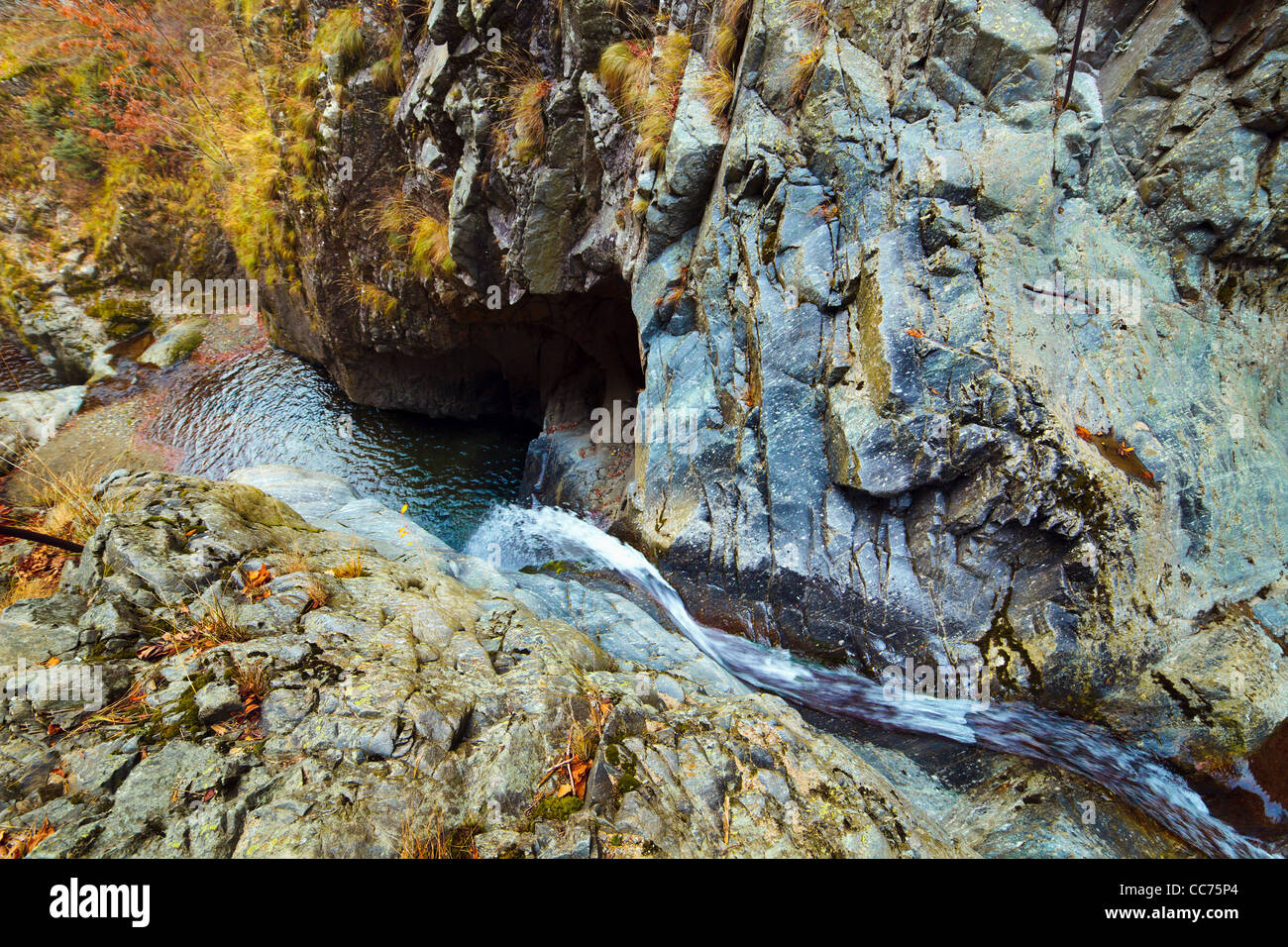 Landscape with waterfall in the mountains Stock Photo - Alamy