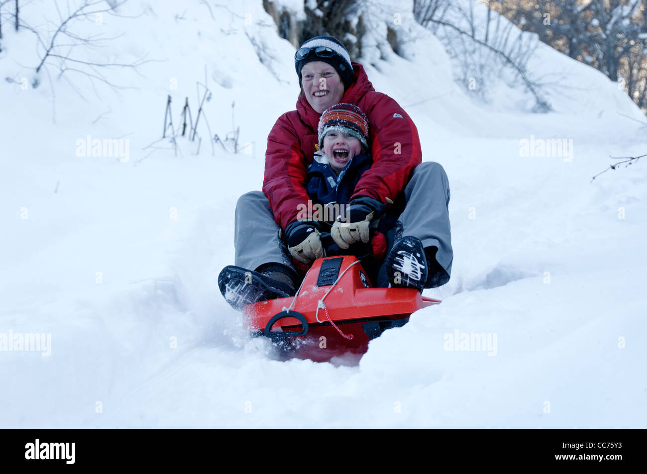 Boy on a sledge hi-res stock photography and images - Alamy