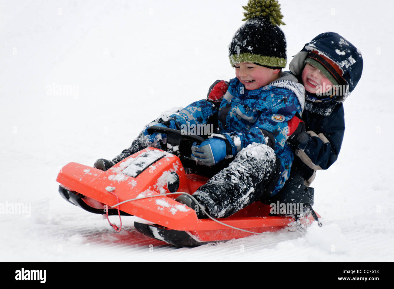 Young boys on a sledge Stock Photo - Alamy